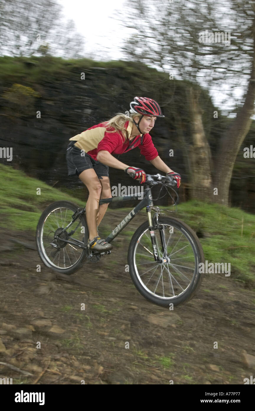 Female Mountain Biker riding a Trail Stock Photo - Alamy
