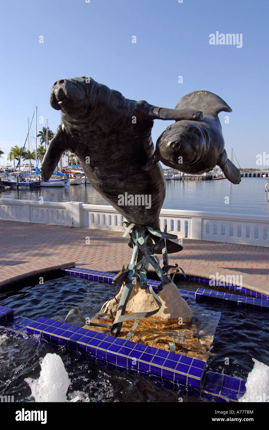 Statue of a female manatee and child on the downtown waterfront in ...