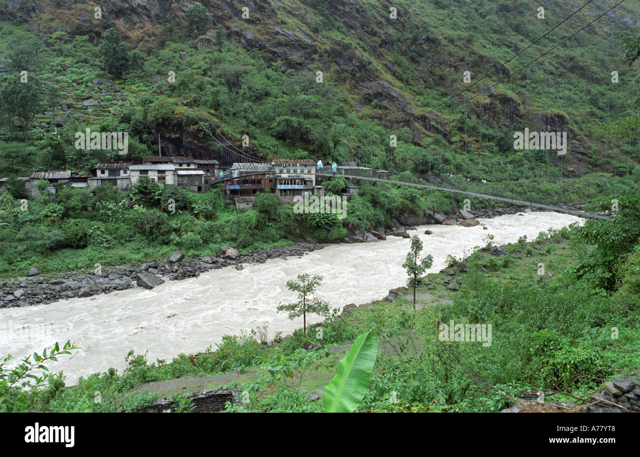 Scenic of suspension bridge over Marsyangdi River in Syange area ...