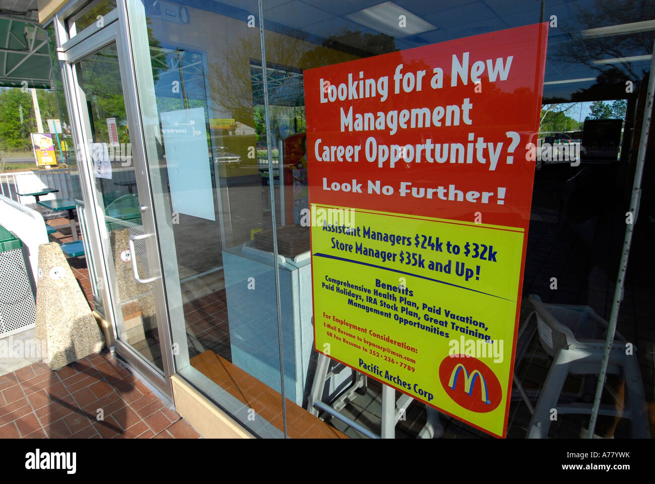 Help wanted poster posted in the window of a fast food restaurant Stock ...