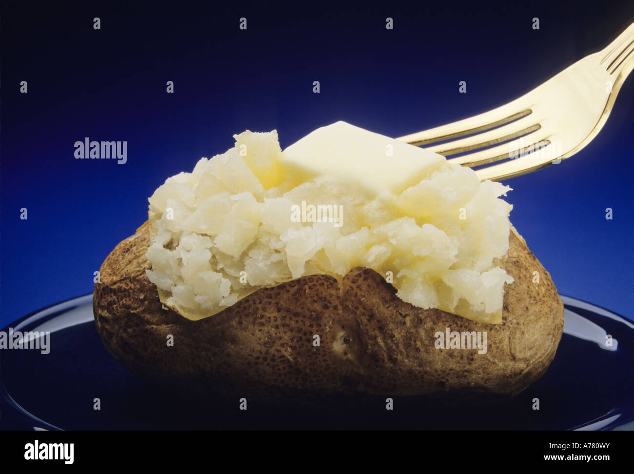 Baked Potato with Butter Stock Photo - Alamy