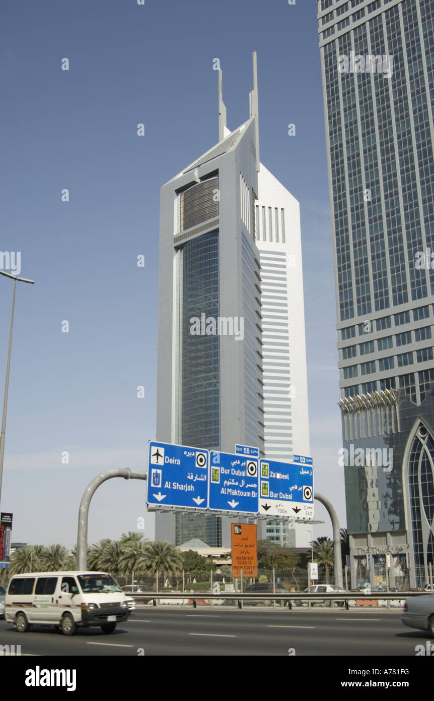 Road signs and Emirates Towerson Sheik Zayed road Dubai Stock Photo - Alamy