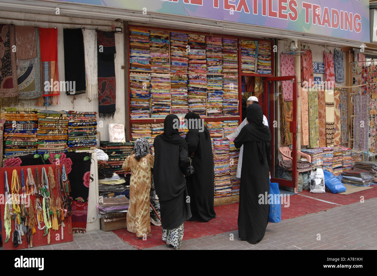 emirati women shopping at the Textile souk Stock Photo - Alamy