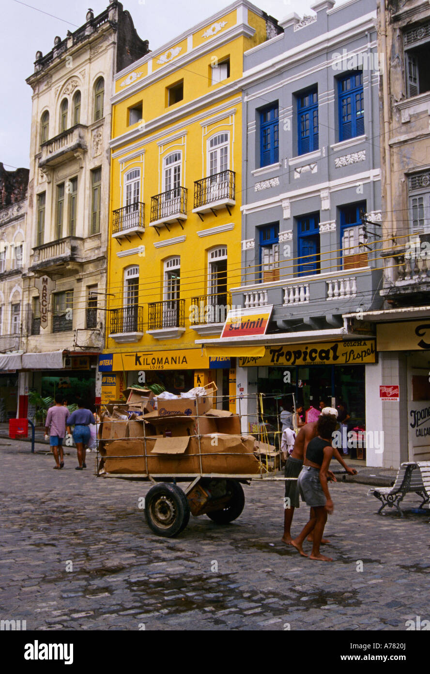 colonial buildings and people with hand cart in the centre of Recife ...
