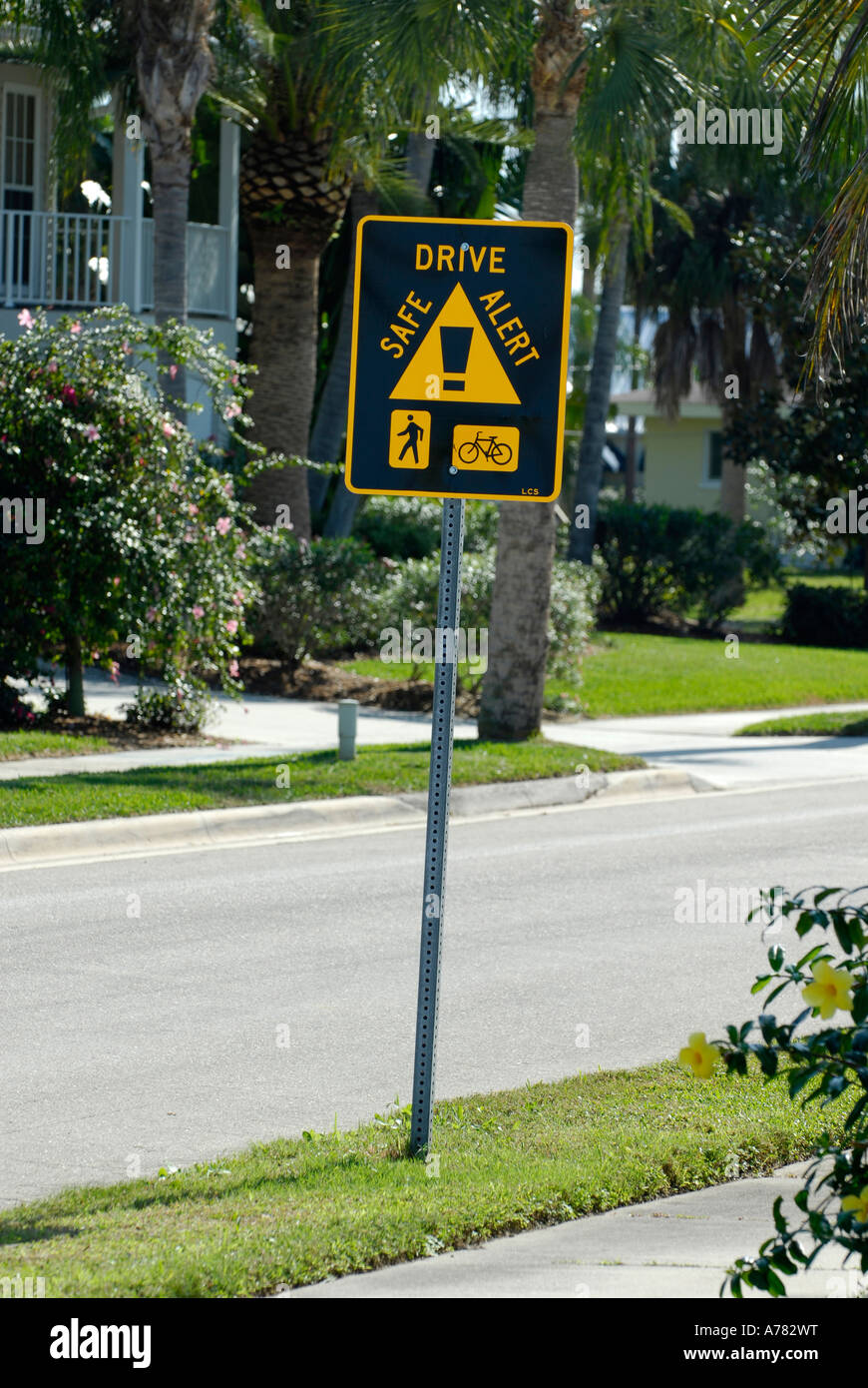 drive safe and alert sign on a neighborhood street Stock Photo - Alamy