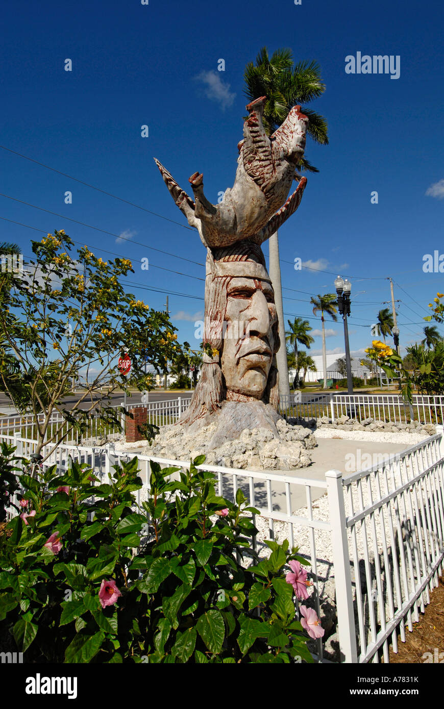 Artist wood carving of an Indian native American bust on an old tree ...