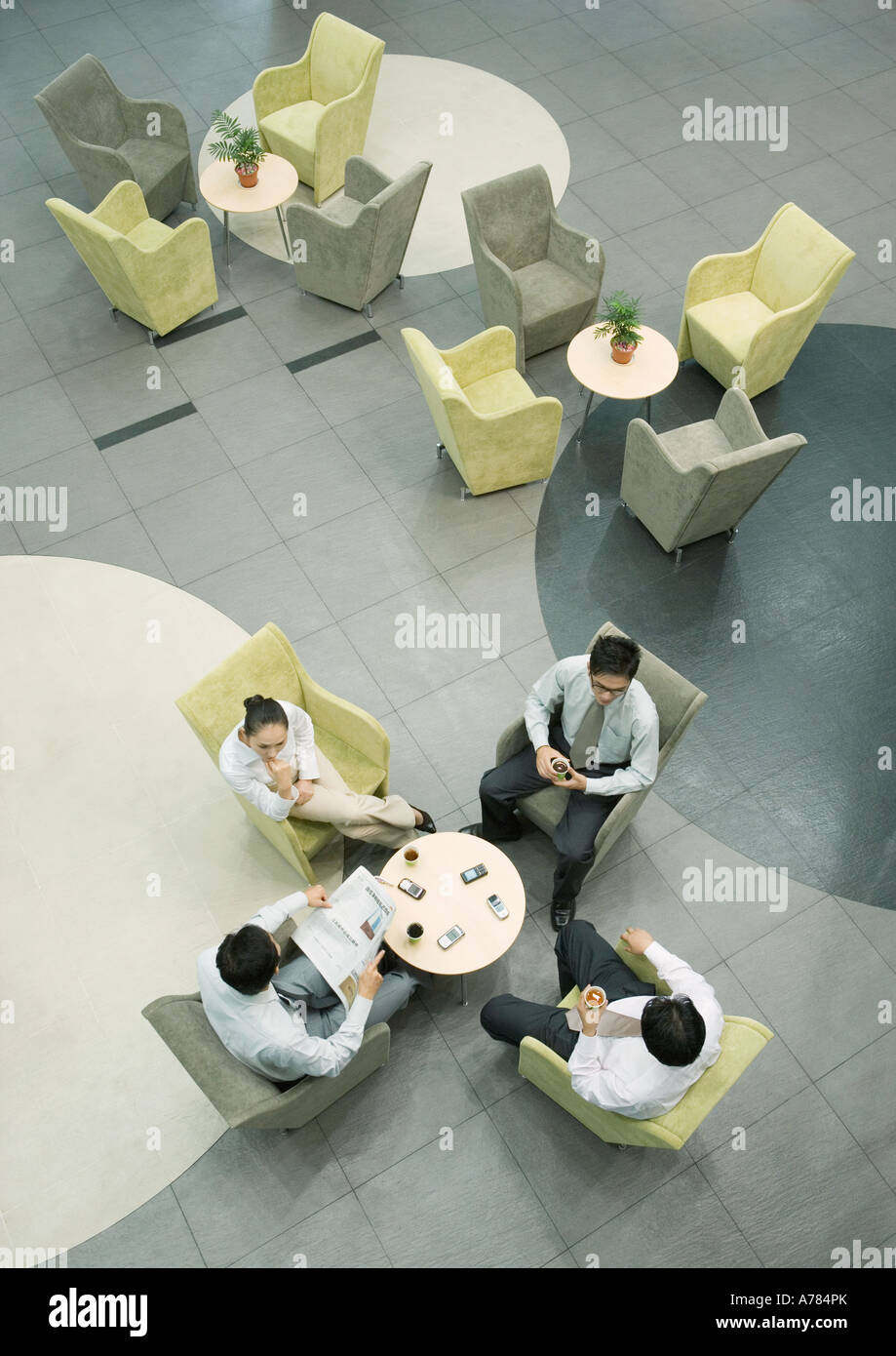 Executives sitting in lobby Stock Photo - Alamy