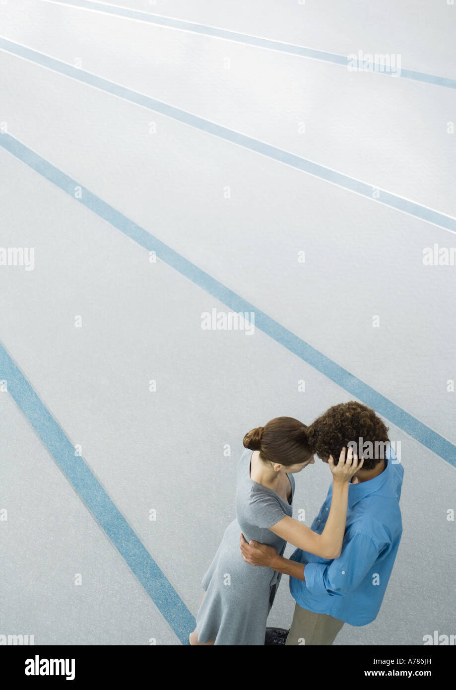 Young couple embracing, high angle view Stock Photo - Alamy