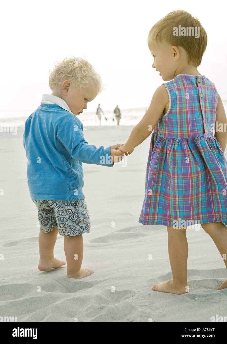 Two Toddlers Holding Hands Walking Stock Photos & Two Toddlers Holding ...