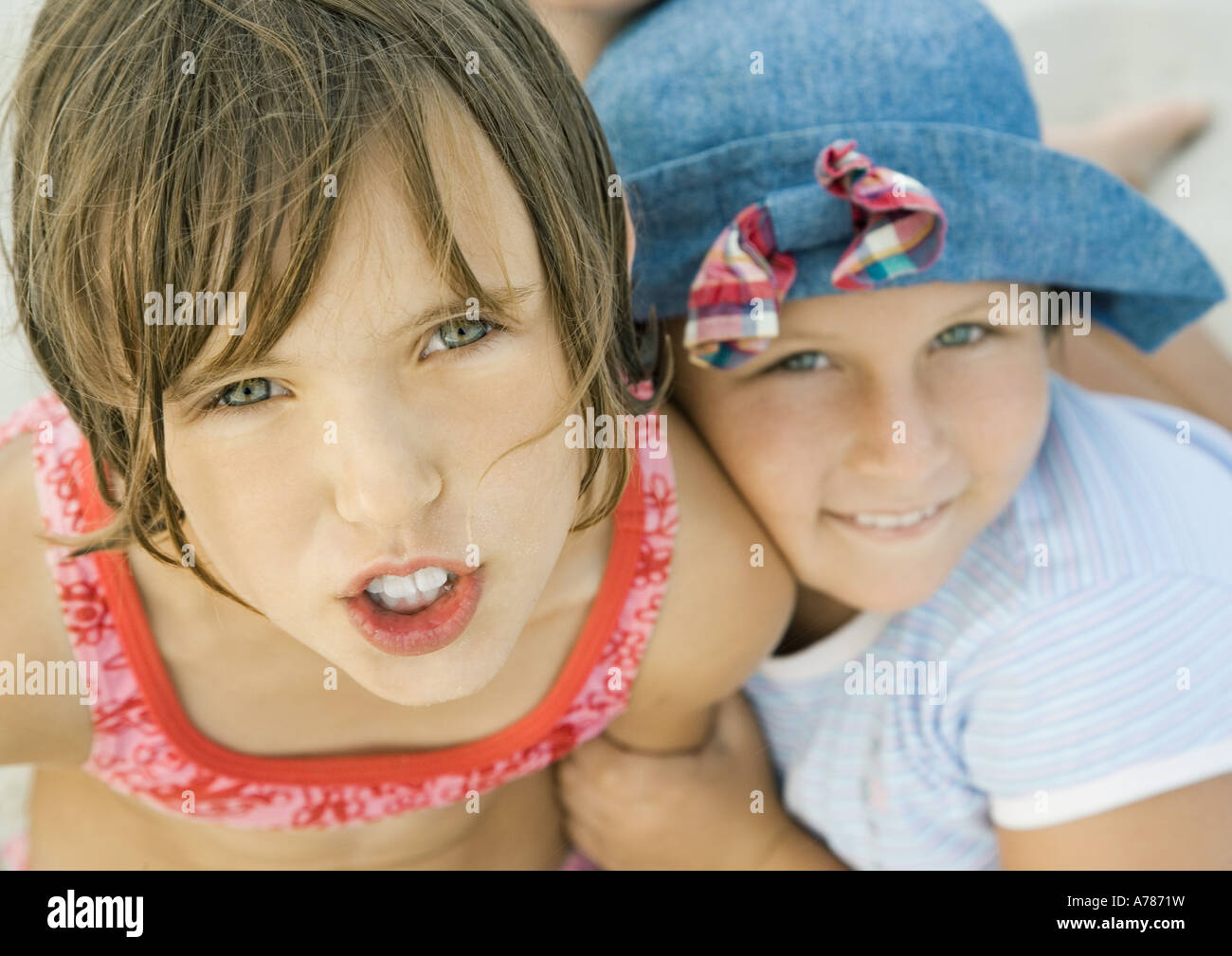 Two girls on beach, close-up portrait Stock Photo - Alamy