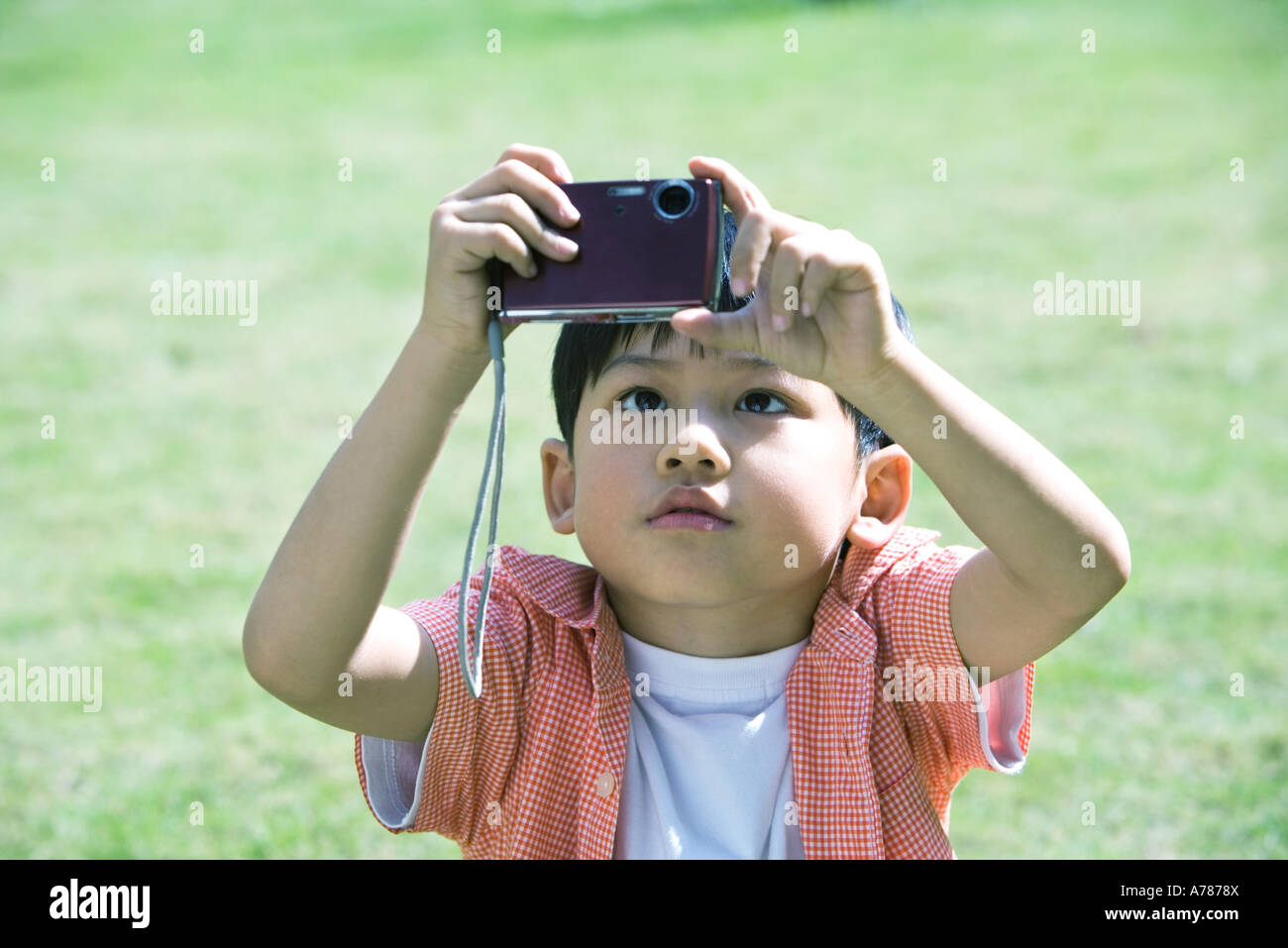 Boy using digital camera Stock Photo - Alamy