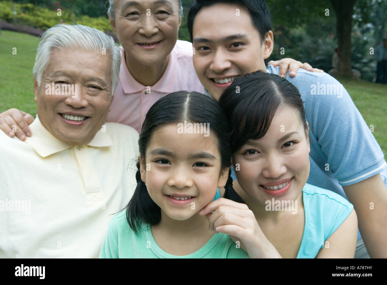 Three generation family in park, portrait Stock Photo - Alamy