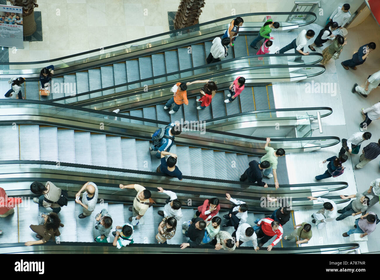 People taking escalators, high angle view Stock Photo - Alamy
