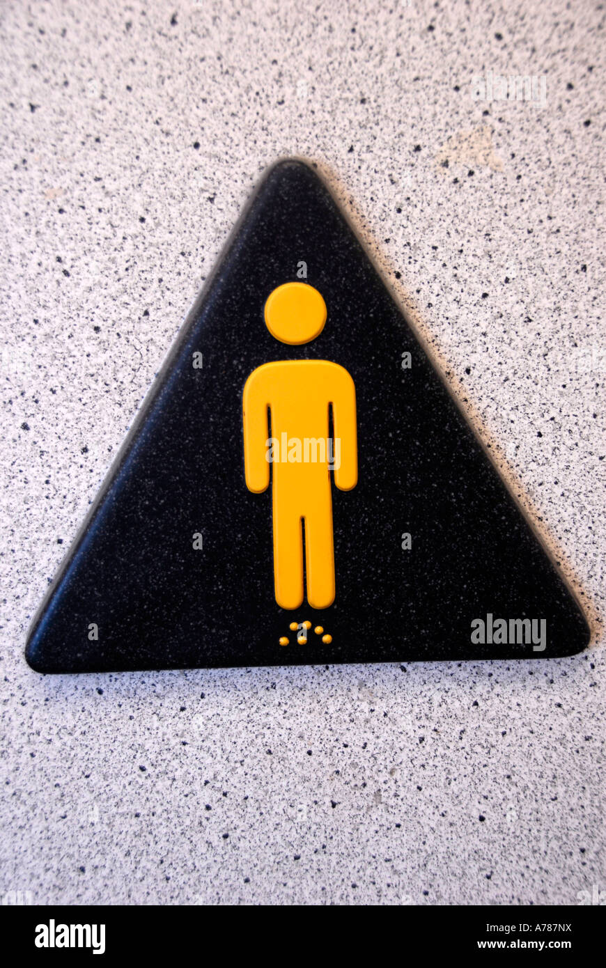 International symbol for a restroom with brailed letters Stock Photo ...