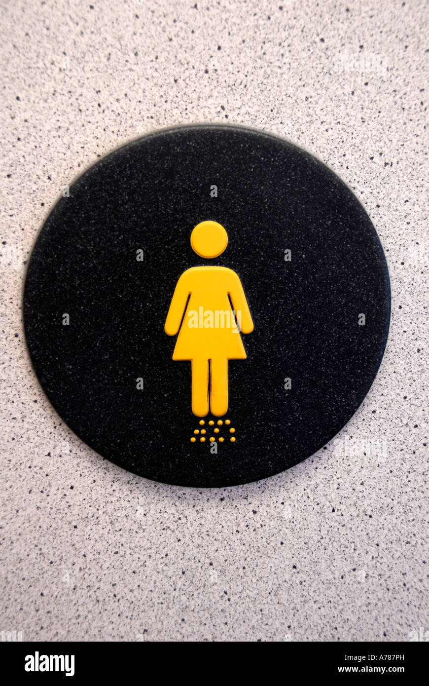 International symbol for a restroom with brailed letters Stock Photo ...