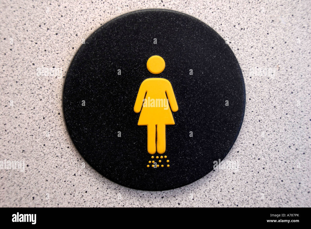 International symbol for a restroom with brailed letters Stock Photo ...