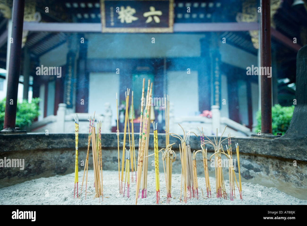 Incense burning in front of temple Stock Photo - Alamy