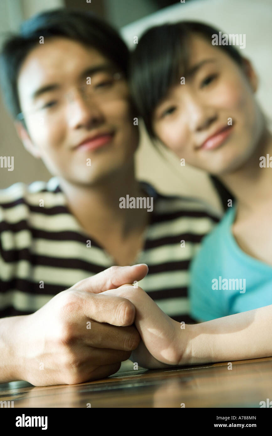 Clasping couples hands hi-res stock photography and images - Alamy