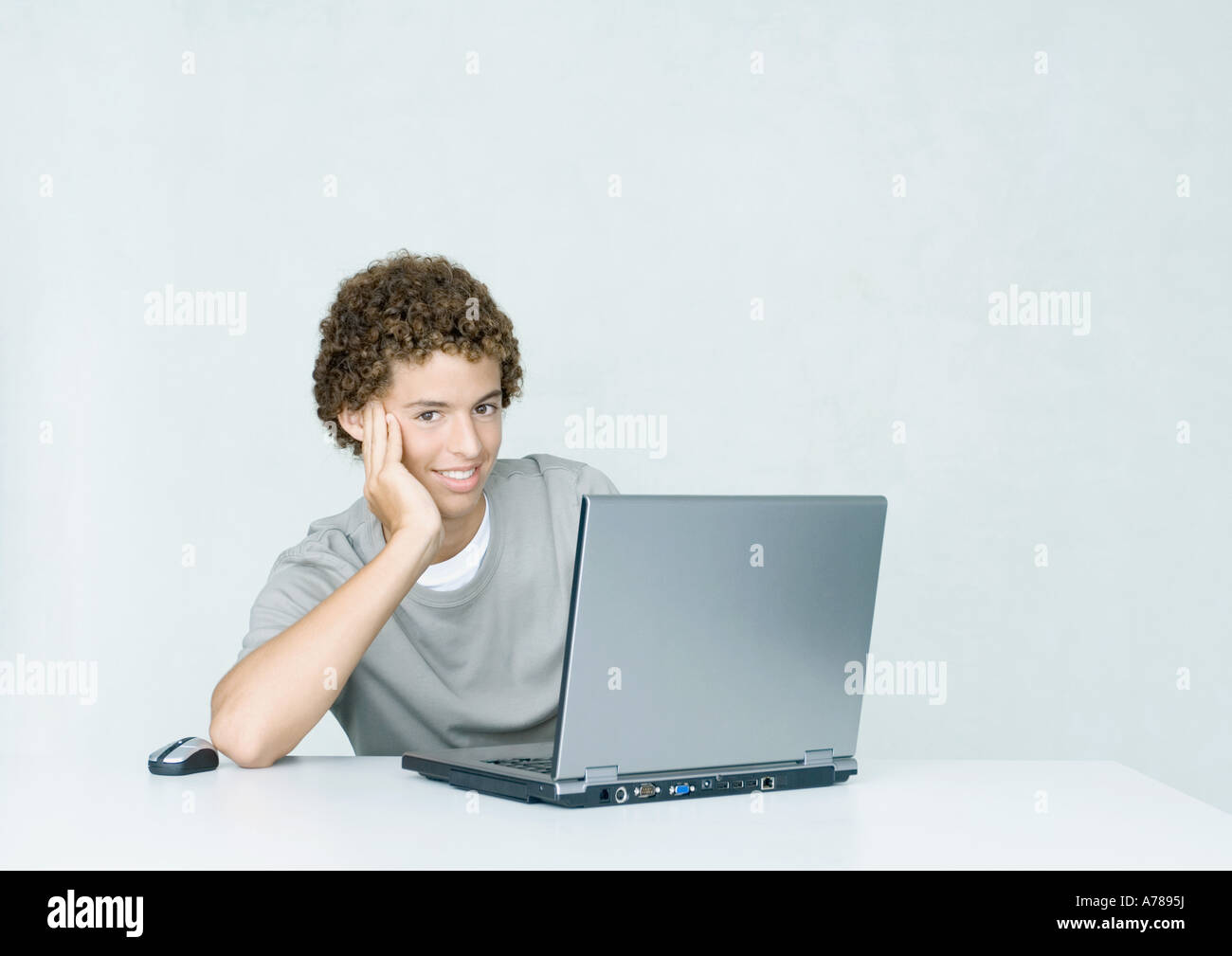 Teenage boy using laptop Stock Photo - Alamy