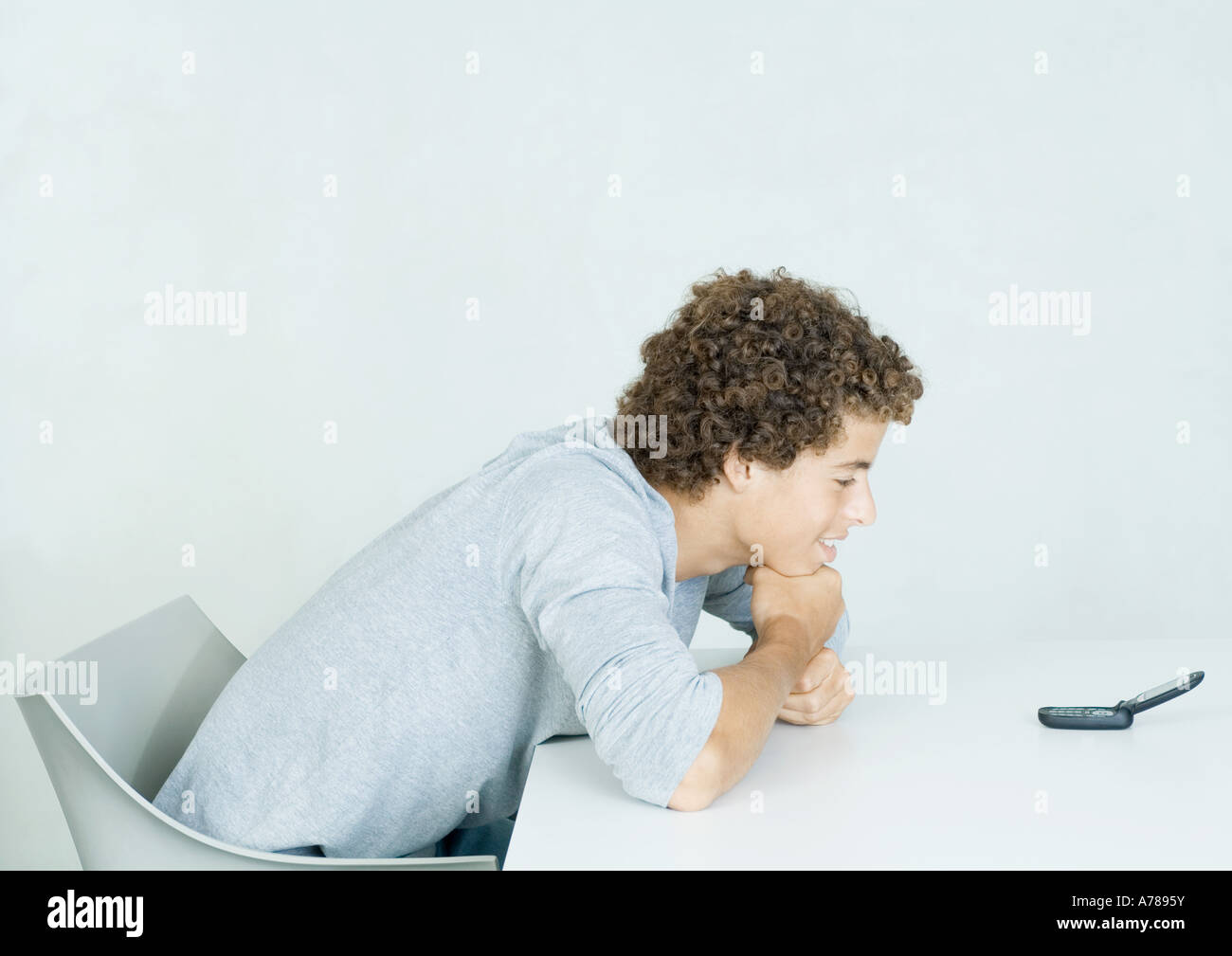 Phone under chin while using hands hi-res stock photography and images ...