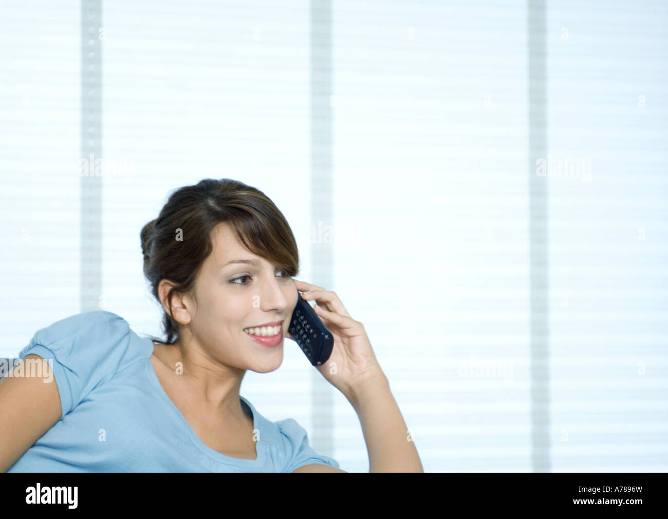 Young woman using cell phone Stock Photo - Alamy
