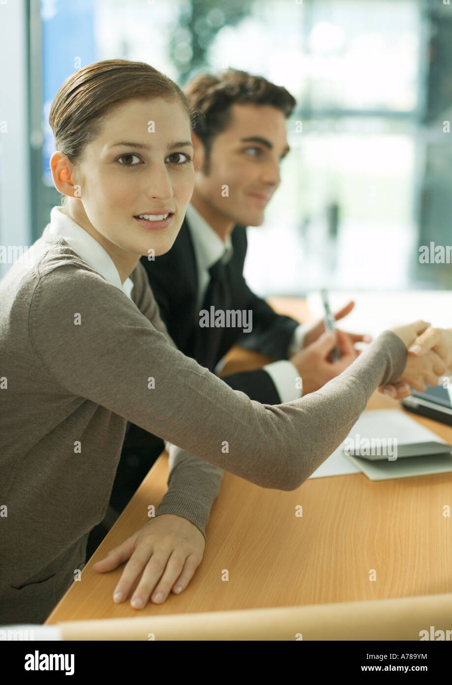 Handshake across table hi-res stock photography and images - Alamy