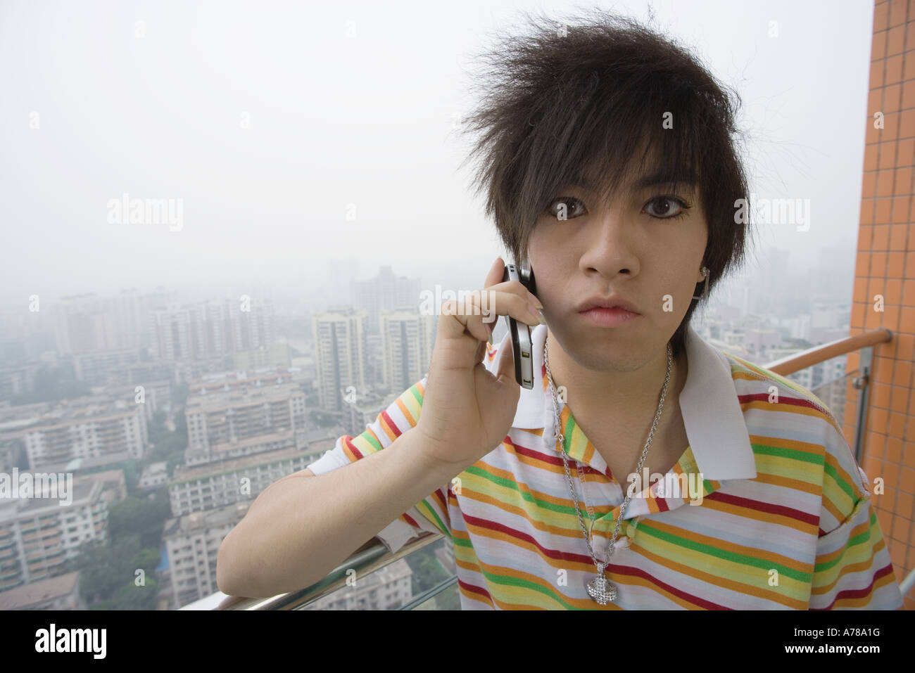 Young man using cell phone Stock Photo - Alamy