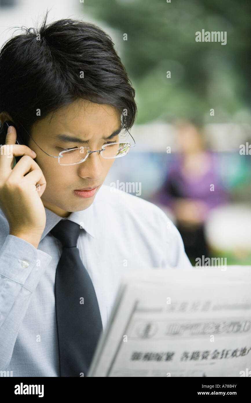 Frowning businessman newspaper hi-res stock photography and images - Alamy