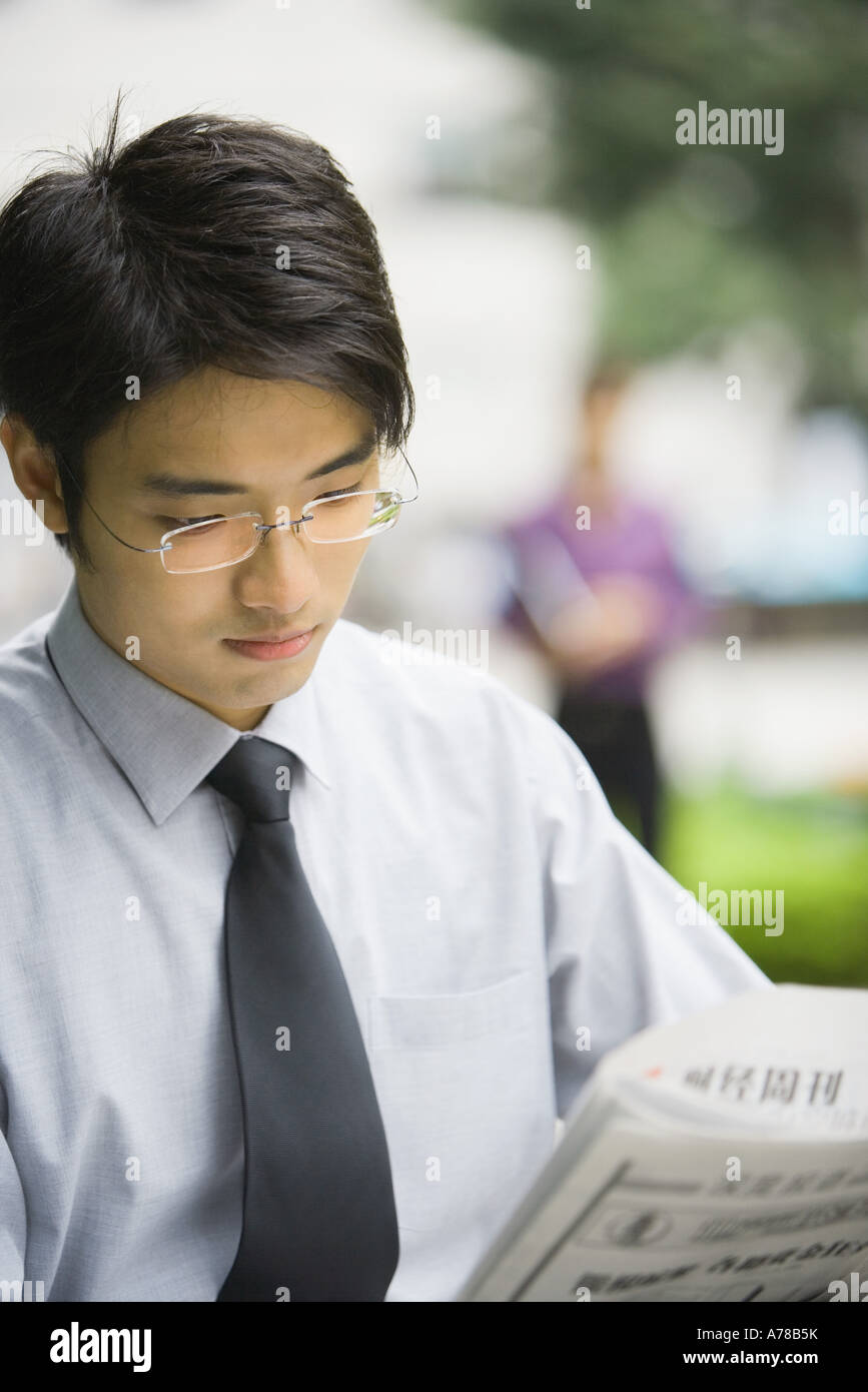 Businessman reading newspaper Stock Photo - Alamy Businessman reading newspaper Stock Photo - Alamy