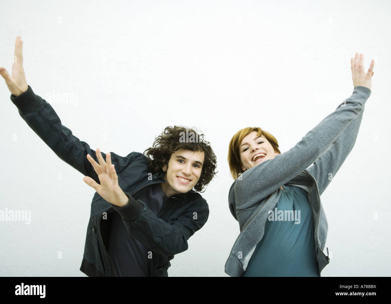 Two young adults, dancing, white background Stock Photo - Alamy