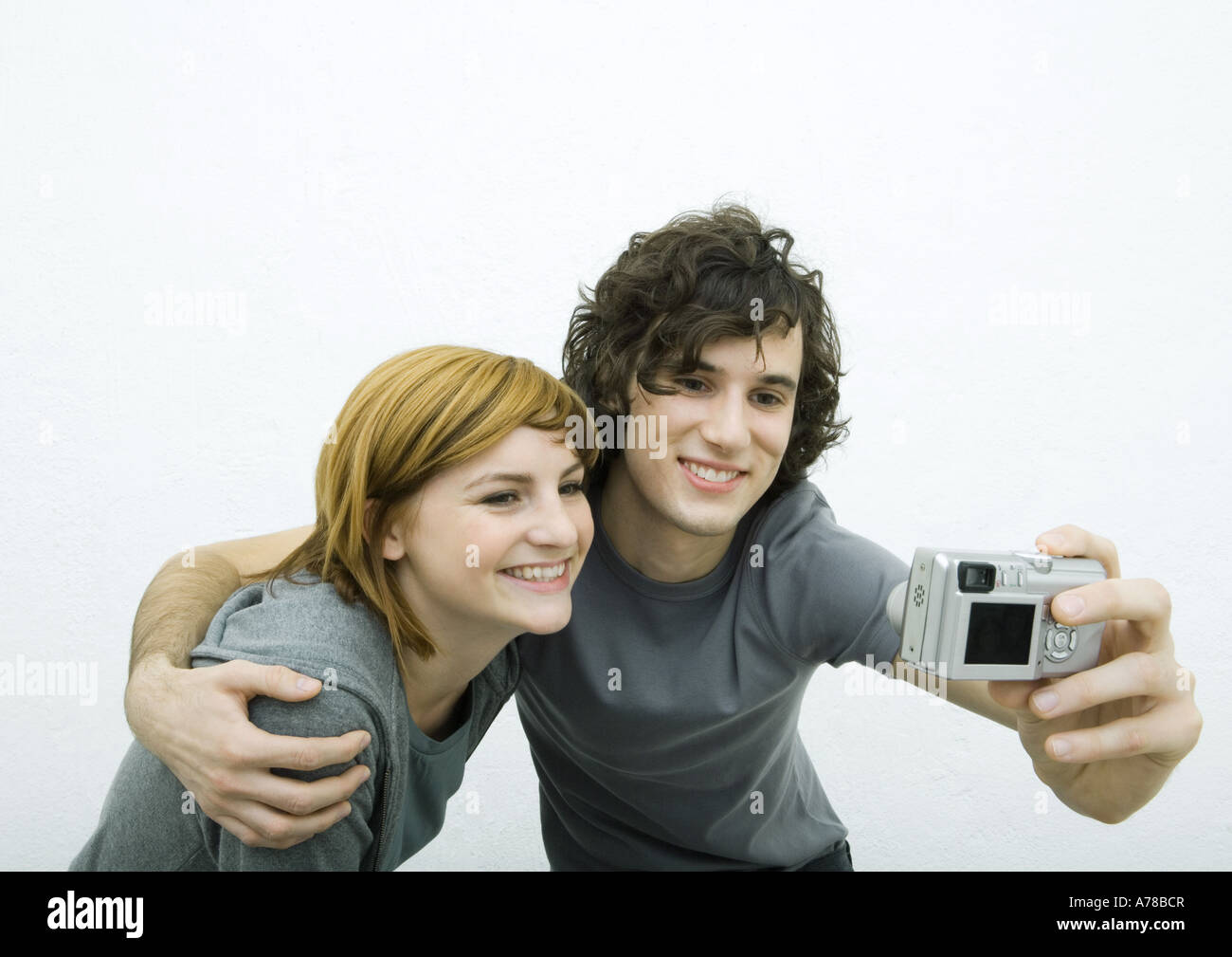 Young couple taking photo together Stock Photo - Alamy