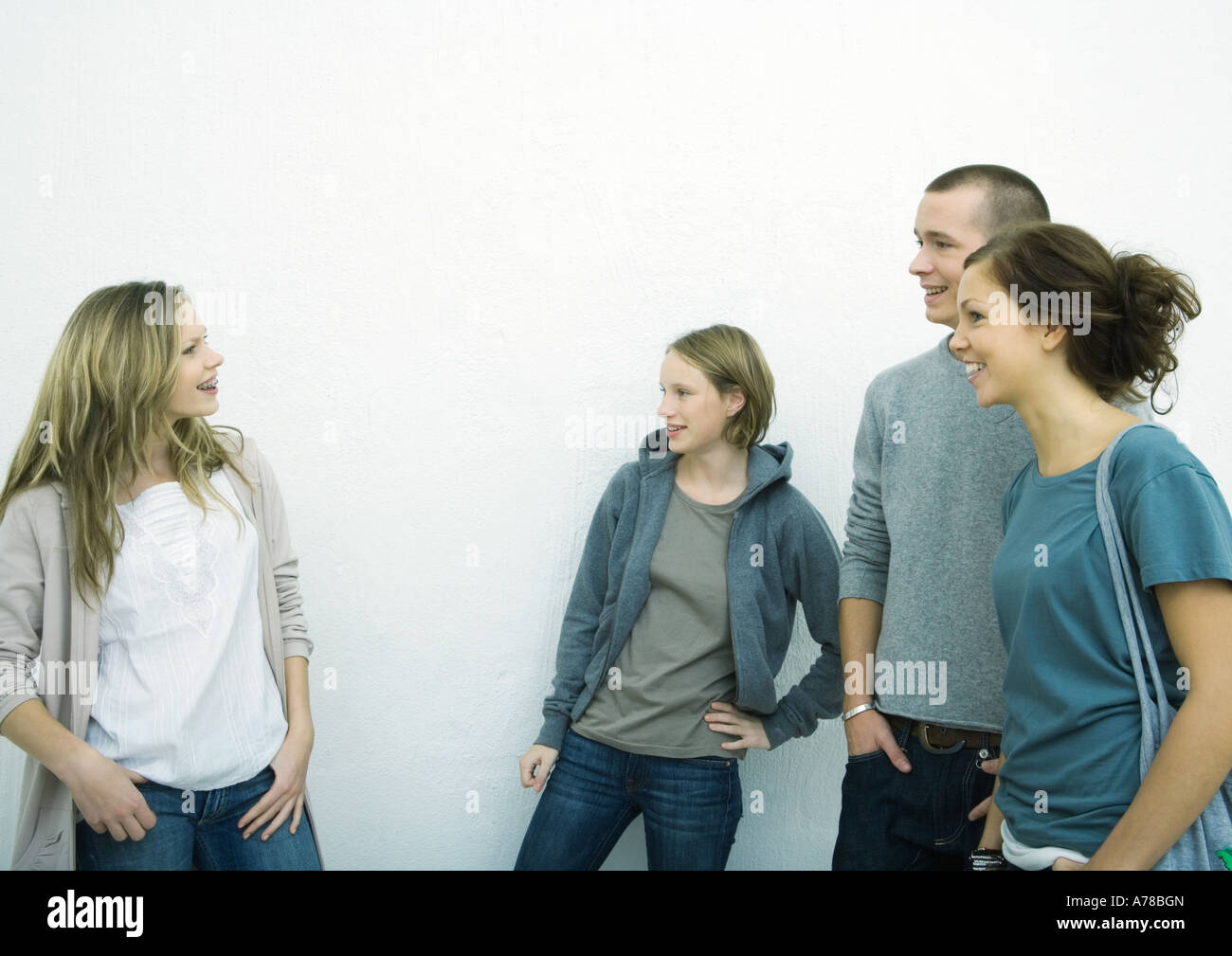 Group of young friends, side view Stock Photo - Alamy