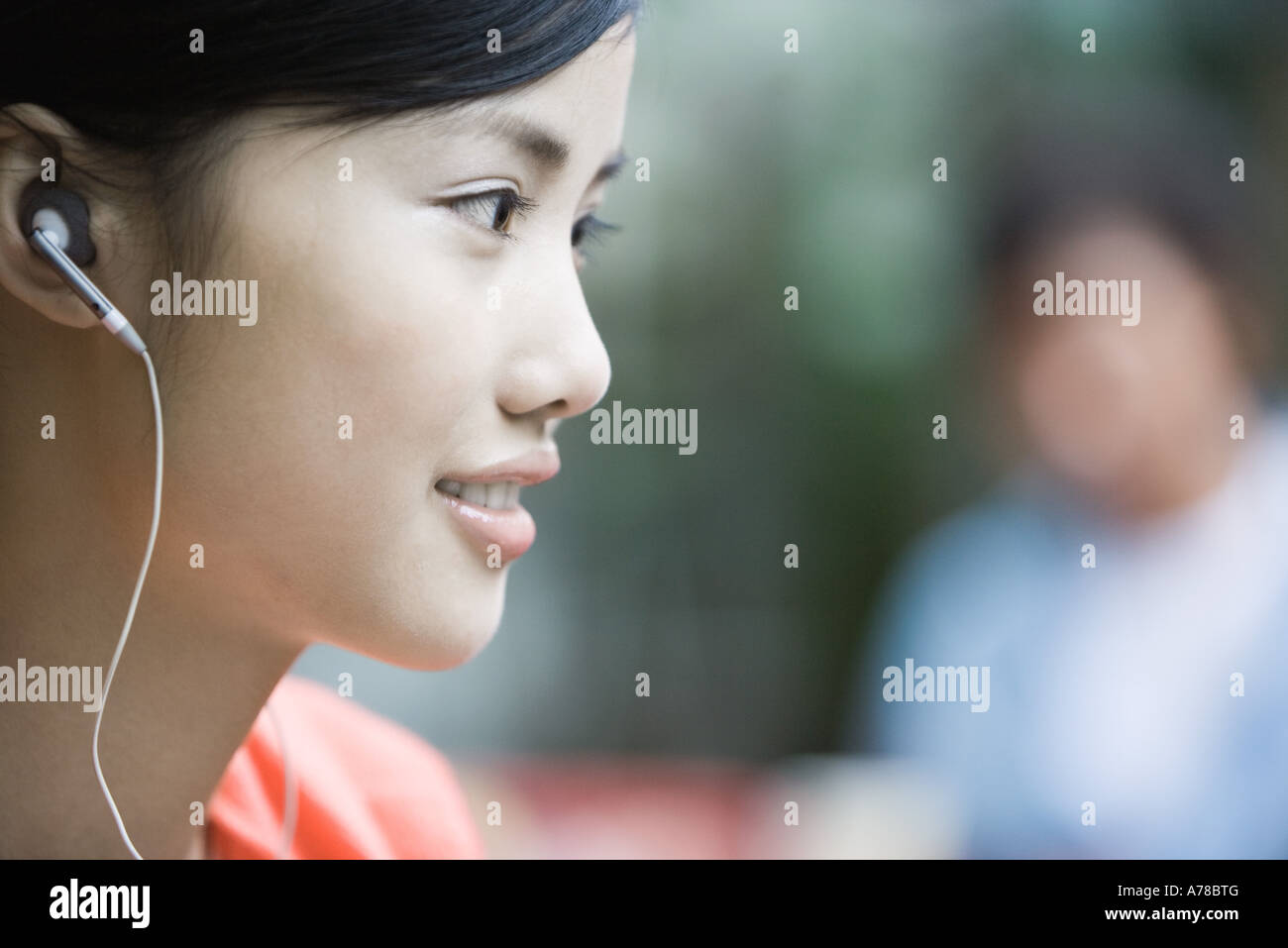 Asia listening music earbuds hi-res stock photography and images - Alamy
