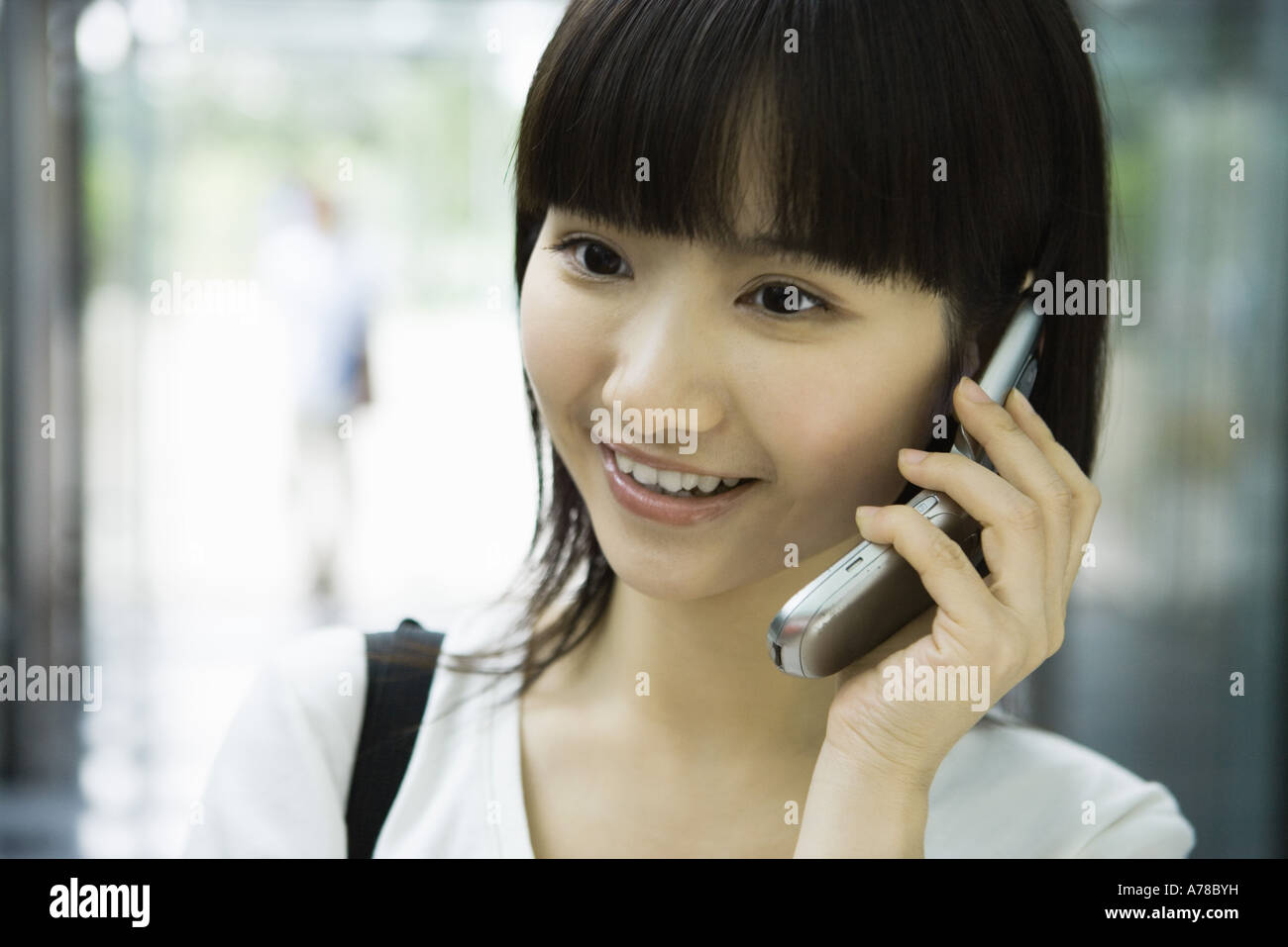 Happy asian woman listens hi-res stock photography and images - Alamy