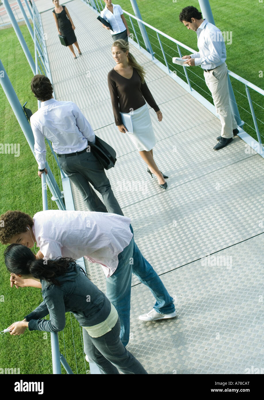 Group of people involved in different activities on walkway Stock Photo ...