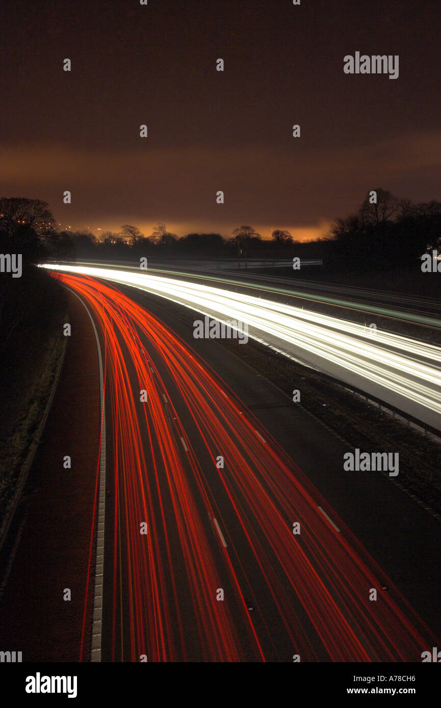 long exposure photo of traffic on a motorway at night with light trails ...