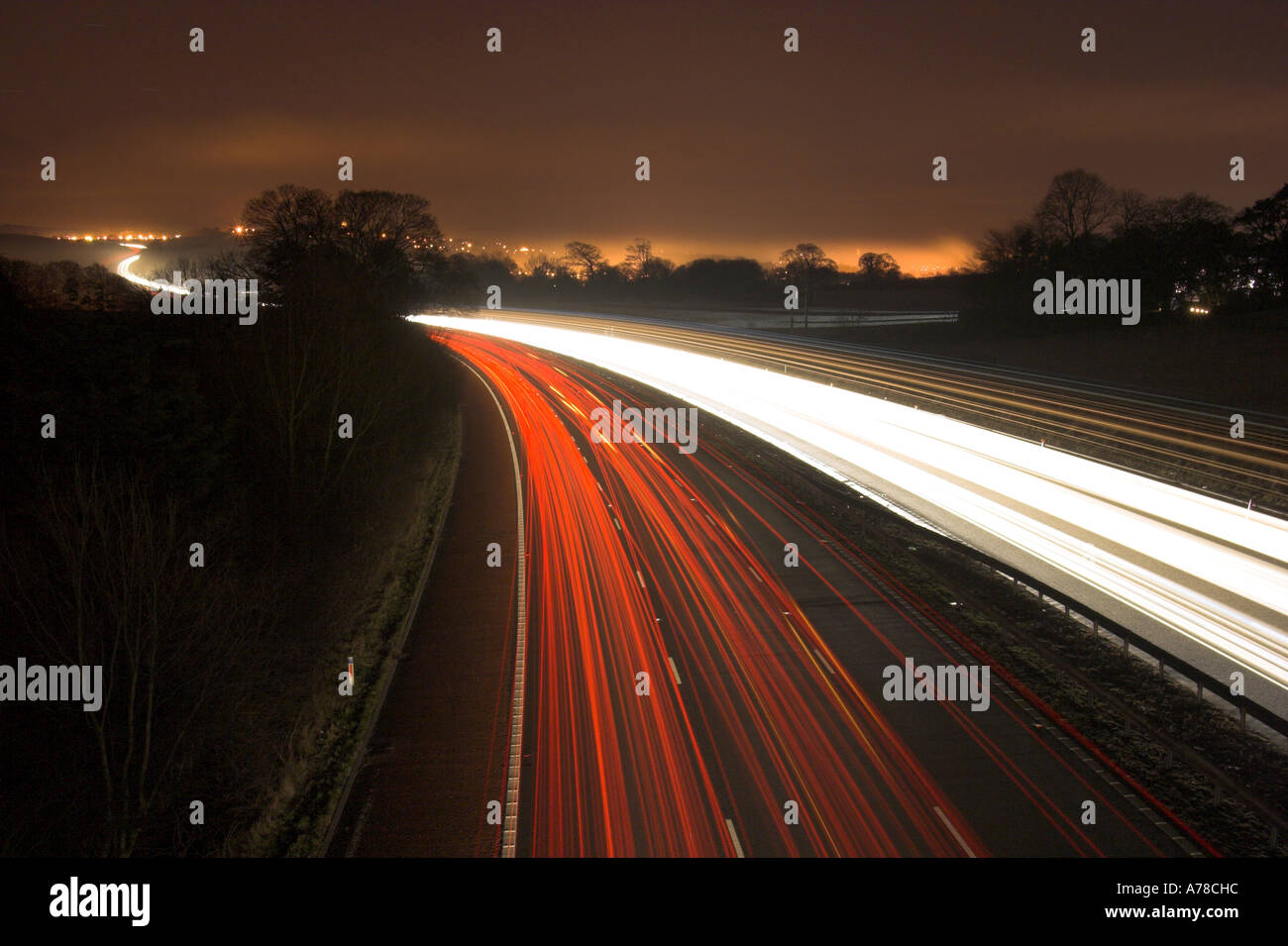 long exposure photo of traffic on a motorway at night with light trails ...