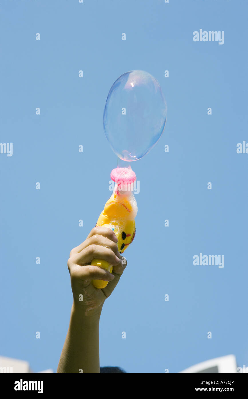 Hand holding bubble wand hi-res stock photography and images - Alamy
