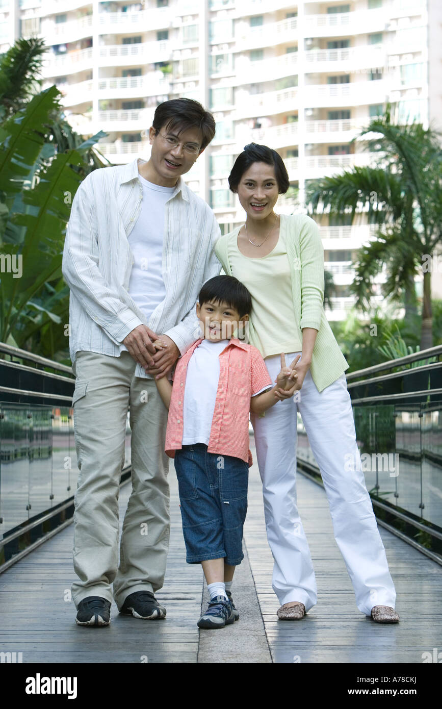 Family standing on walkway, portrait Stock Photo - Alamy