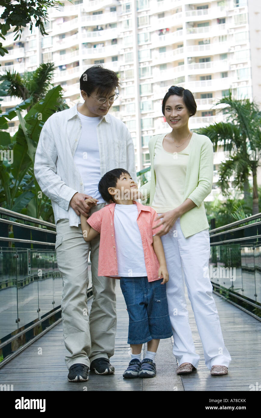 Family standing on walkway, portrait Stock Photo - Alamy