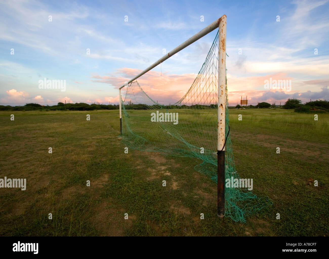 Soccer goal with torn net Stock Photo - Alamy