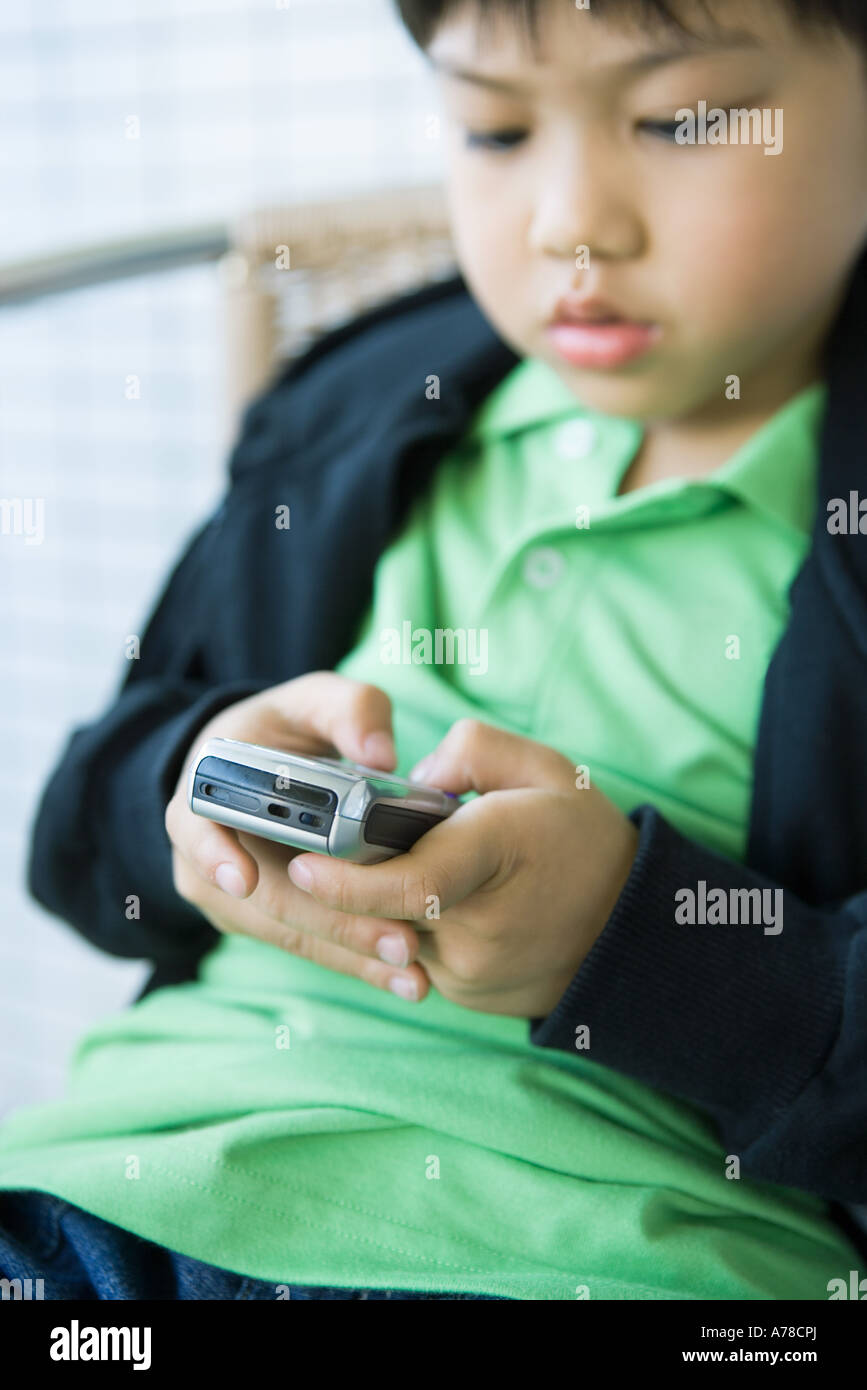 Boy using cell phone Stock Photo - Alamy
