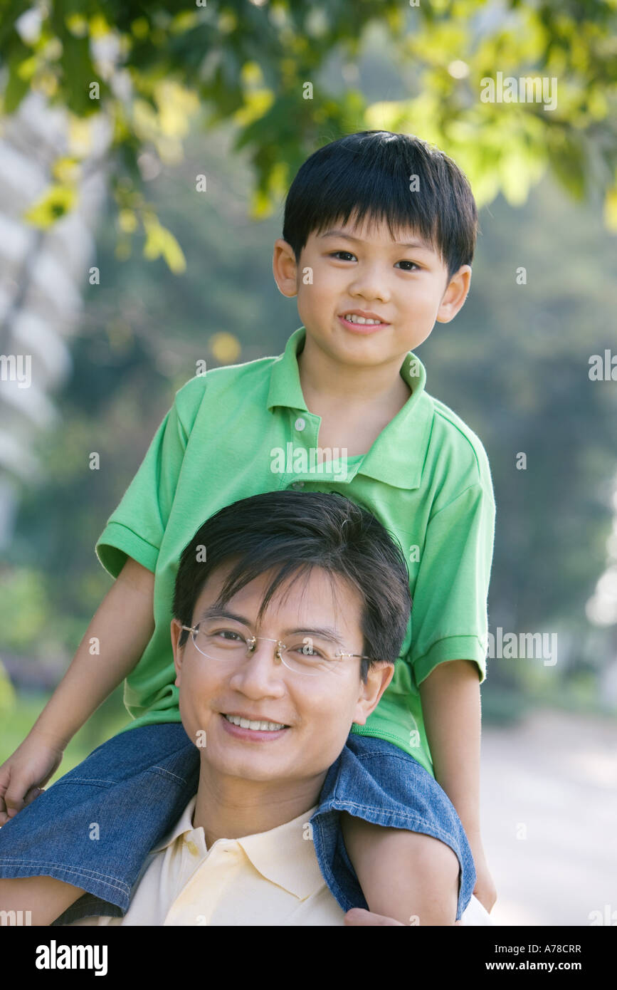 Boy sitting on his dads shoulders hi-res stock photography and images ...