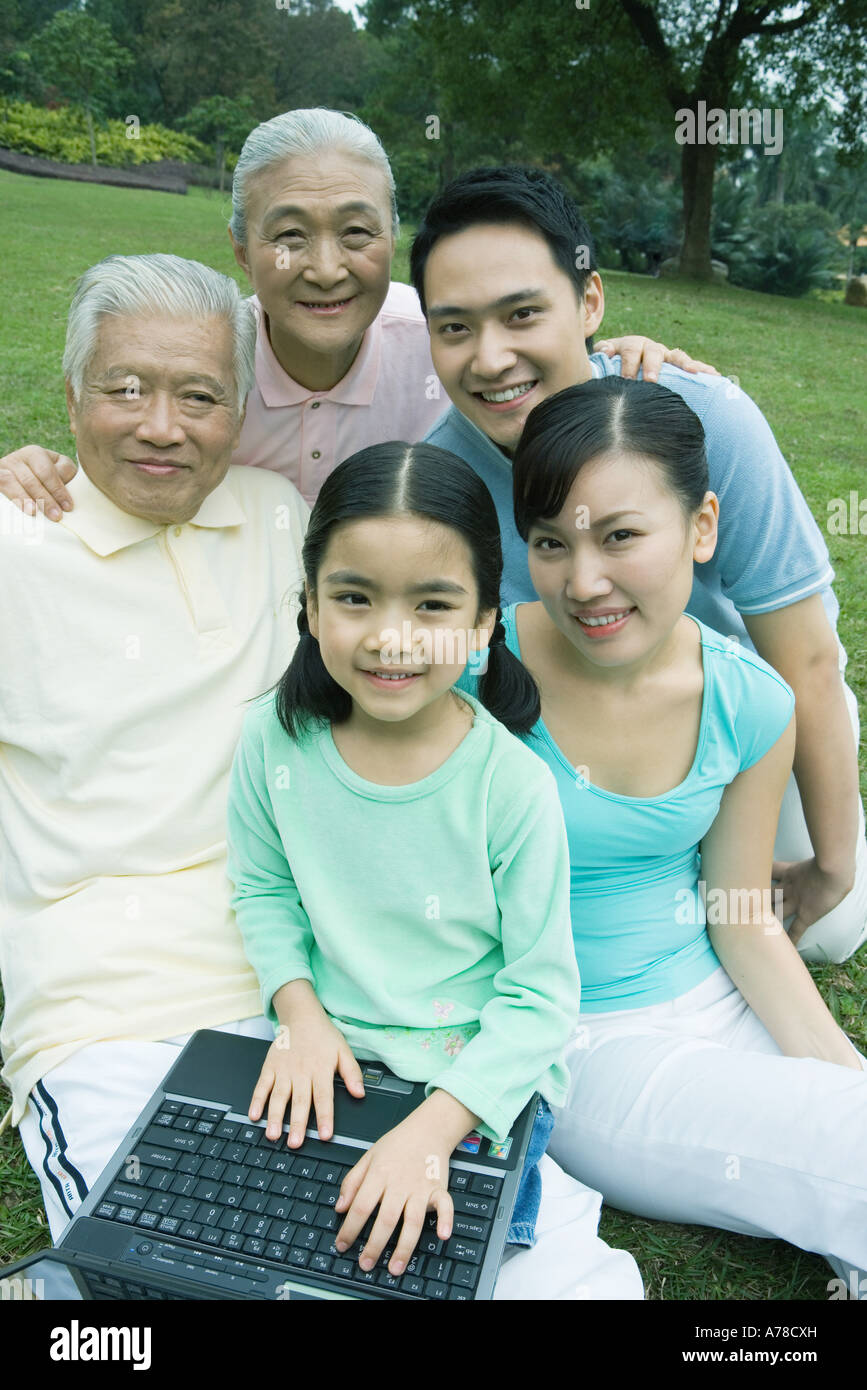 Three generation family with laptop, portrait Stock Photo - Alamy