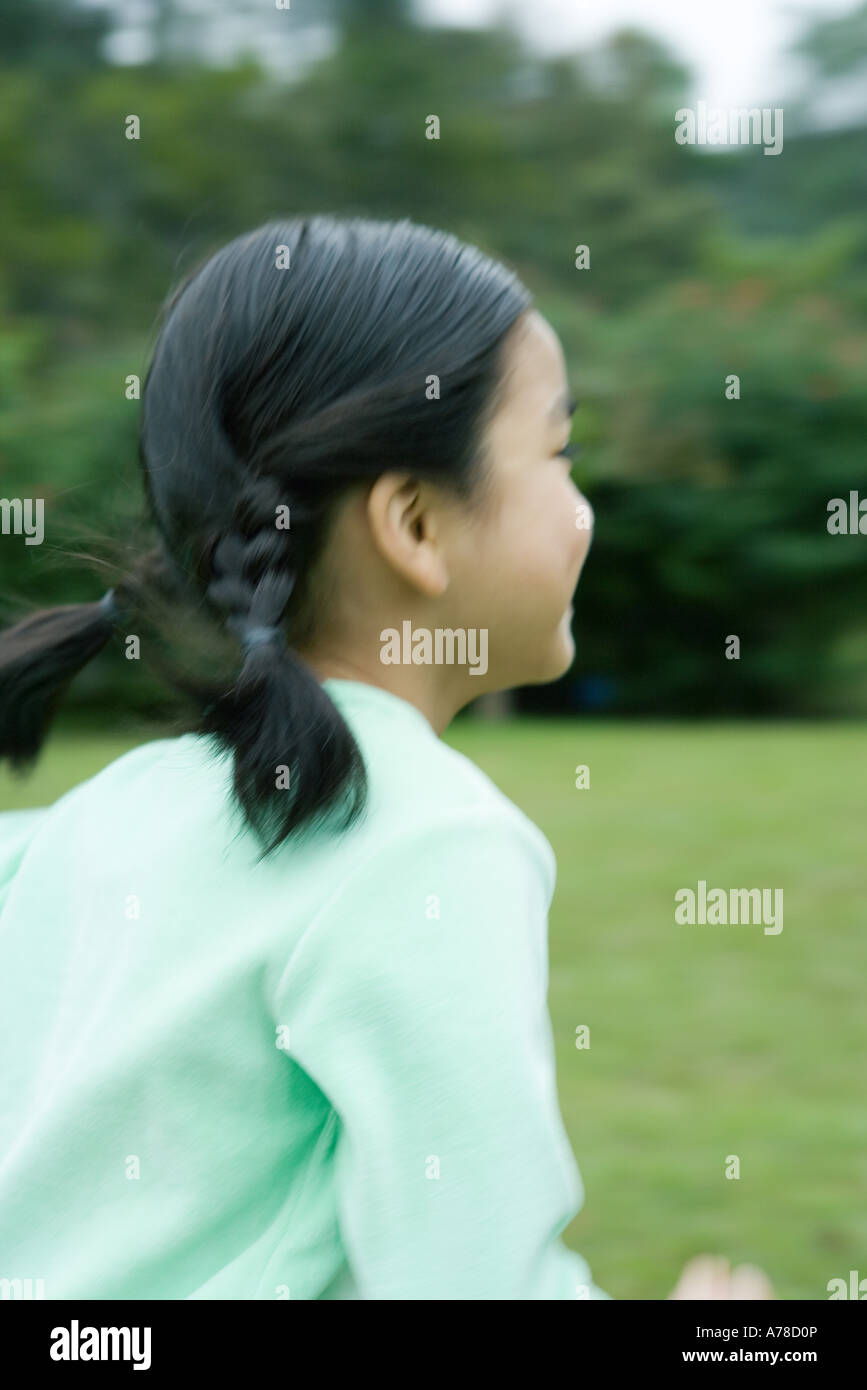 Child running looking back rear view hi-res stock photography and ...