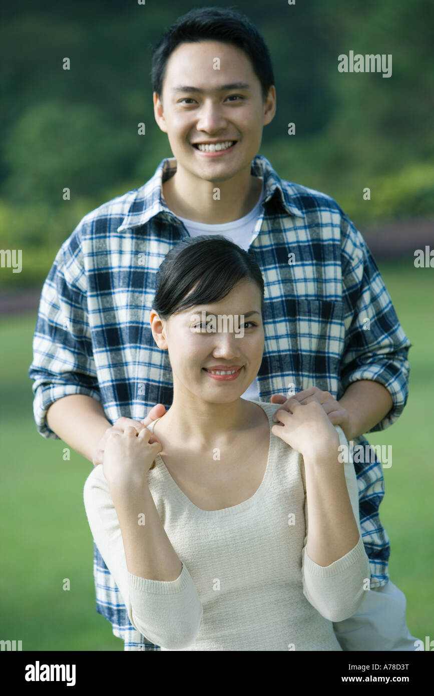 Couple, man with hands on woman's shoulders, portrait Stock Photo - Alamy