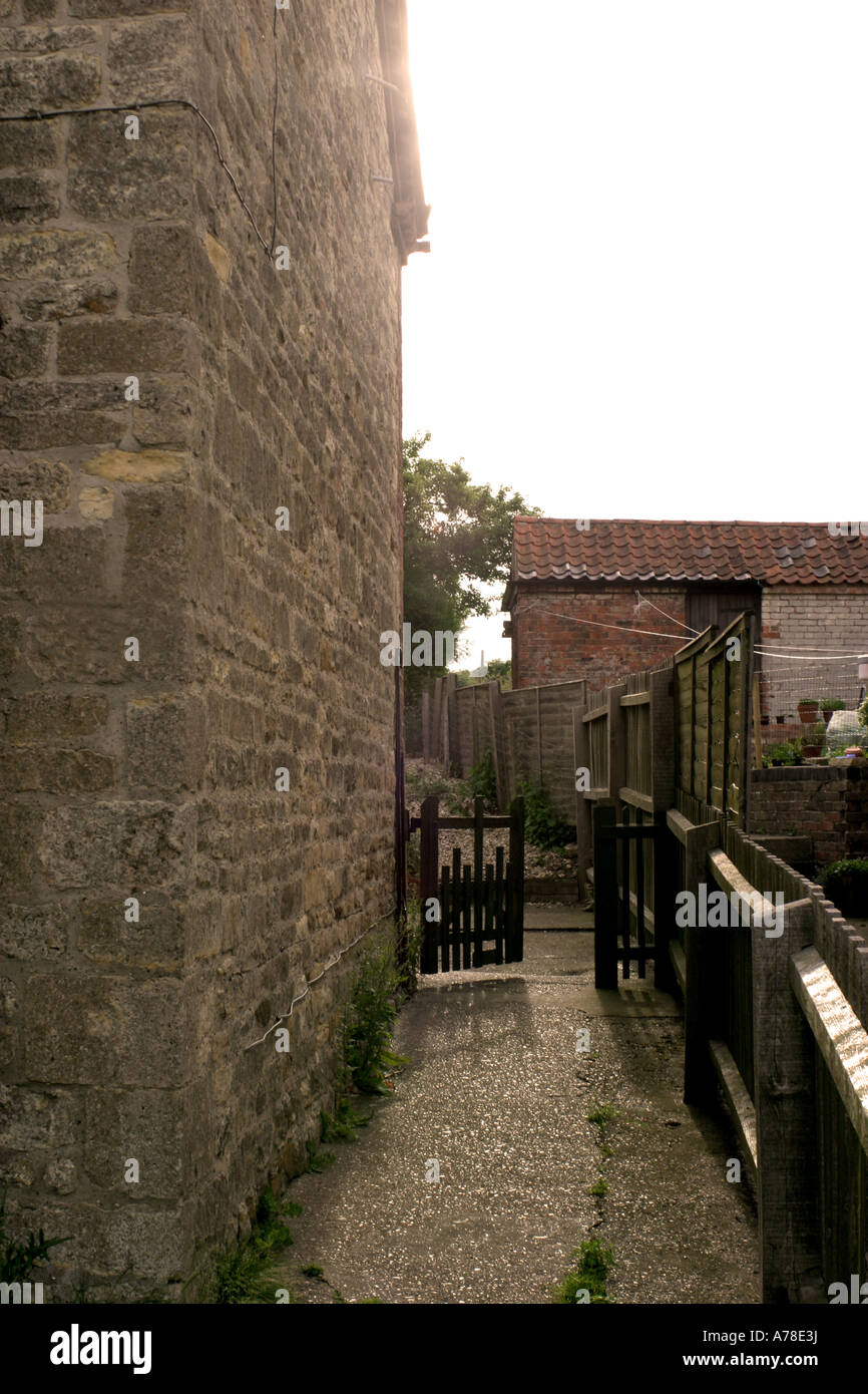 Path gate beside house Stock Photo - Alamy