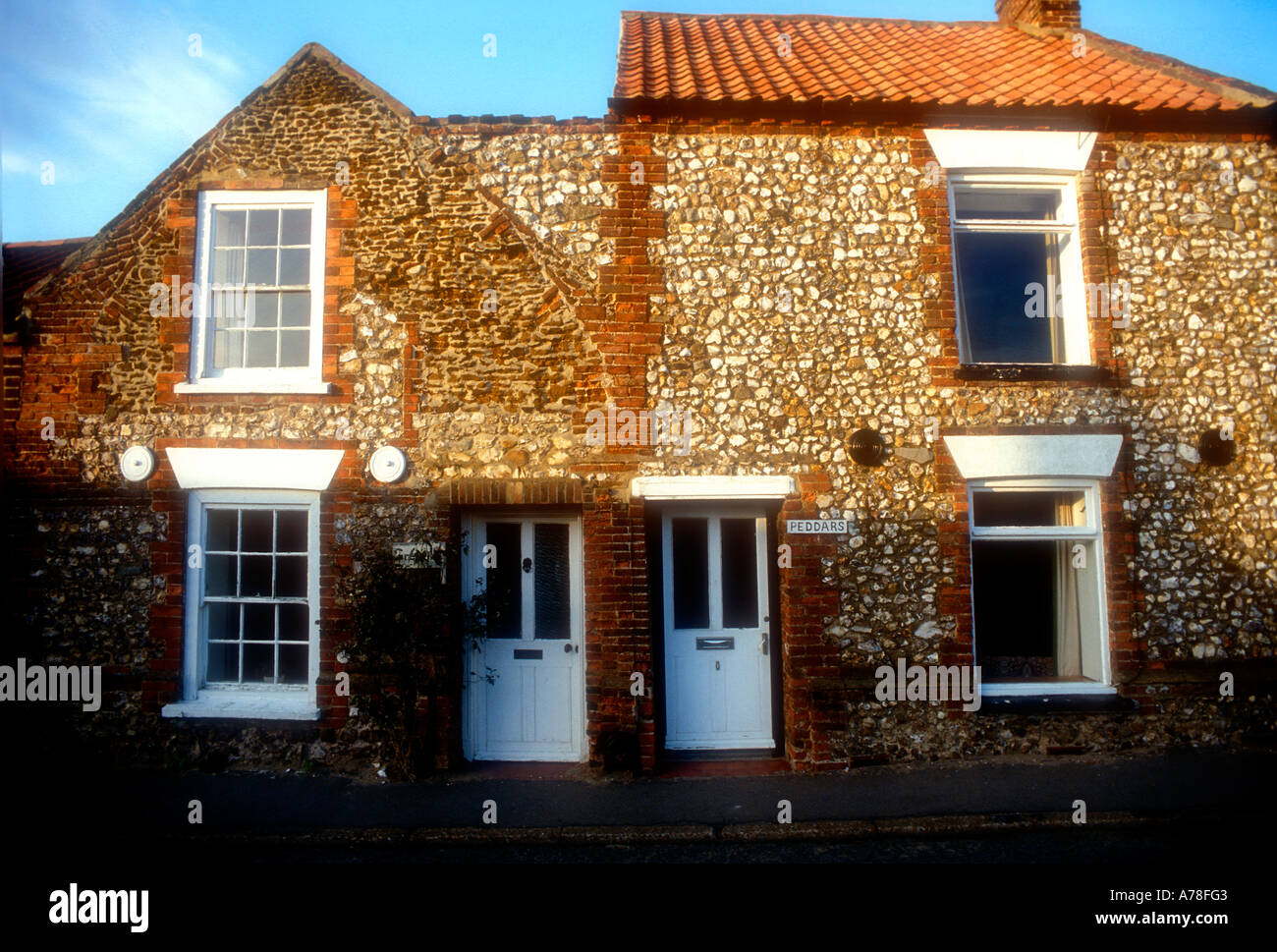 Typical Brick and Flint faced houses at Brancaster Staithe Norfolk Esat ...