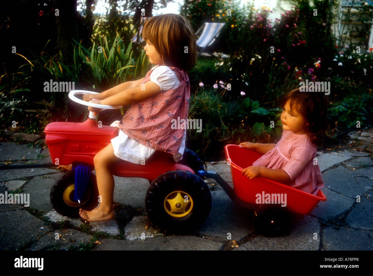 Two sisters play in their garden hi-res stock photography and images ...