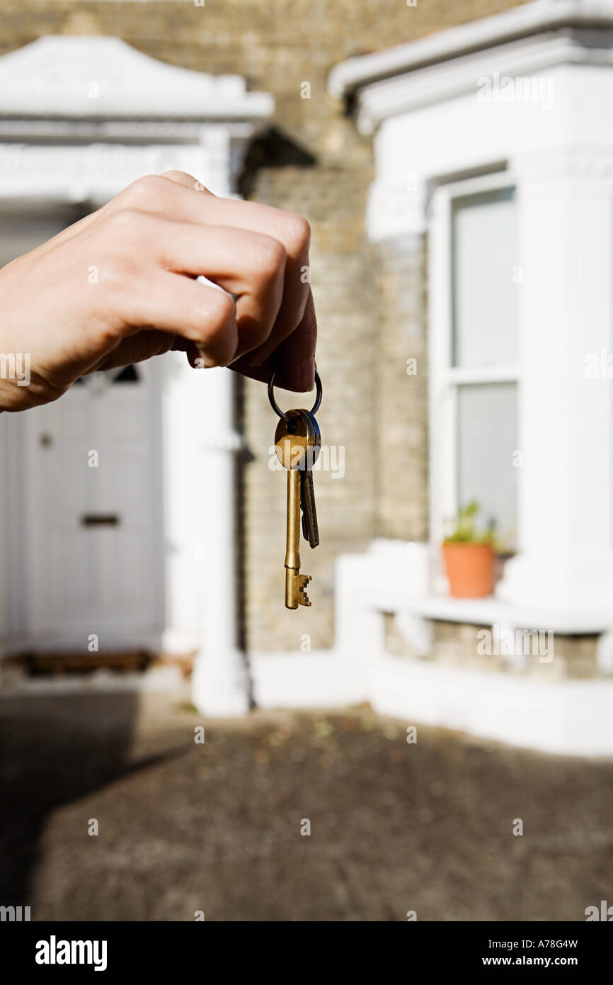 Person with keys to house Stock Photo - Alamy